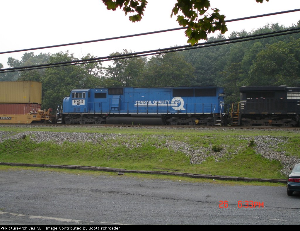 NS 6744 trails long hood forward EB on NS 24V